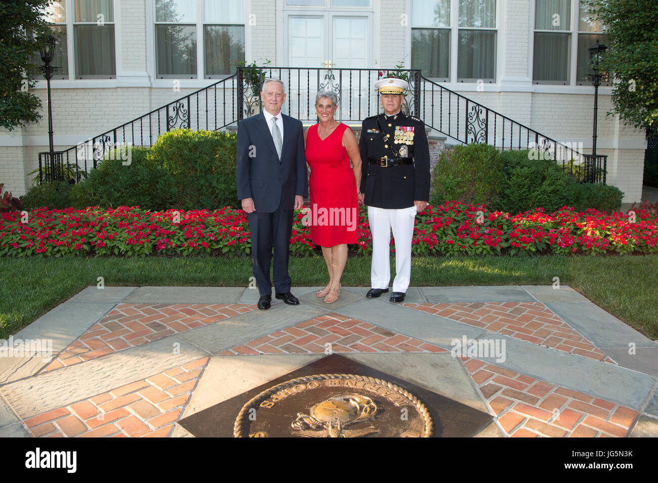 Defense Secretary Jim Mattis stands with Mrs. D'Arcy Neller (center ...