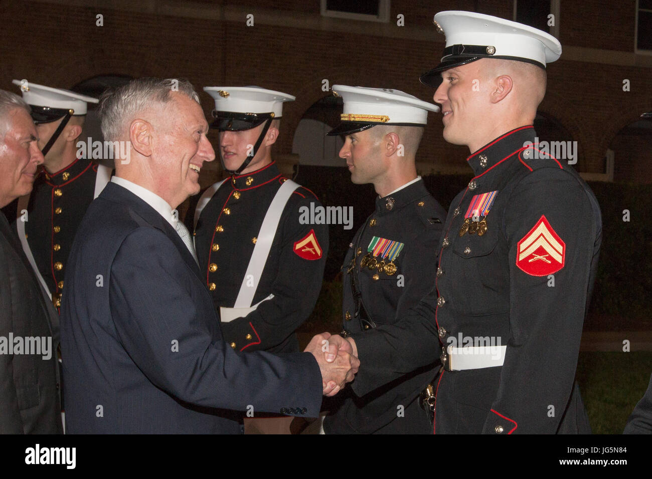 Secretary James N. Mattis, Department of Defense, left, shakes hands ...