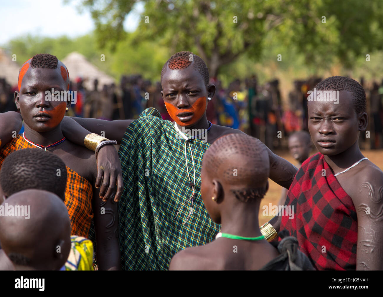 Teenage girls with makeup on the face during the fat men ceremony in ...