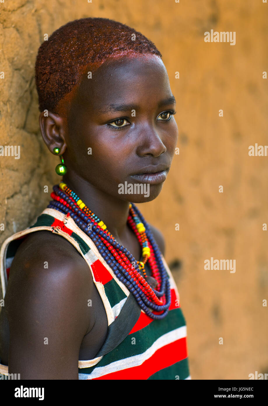 Portrait of a young woman from Hamer tribe with short hair, Omo valley ...