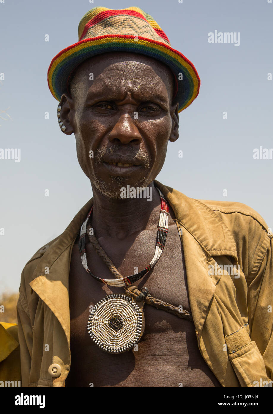Man with a beaded pendant during the proud ox ceremony in Dassanech ...