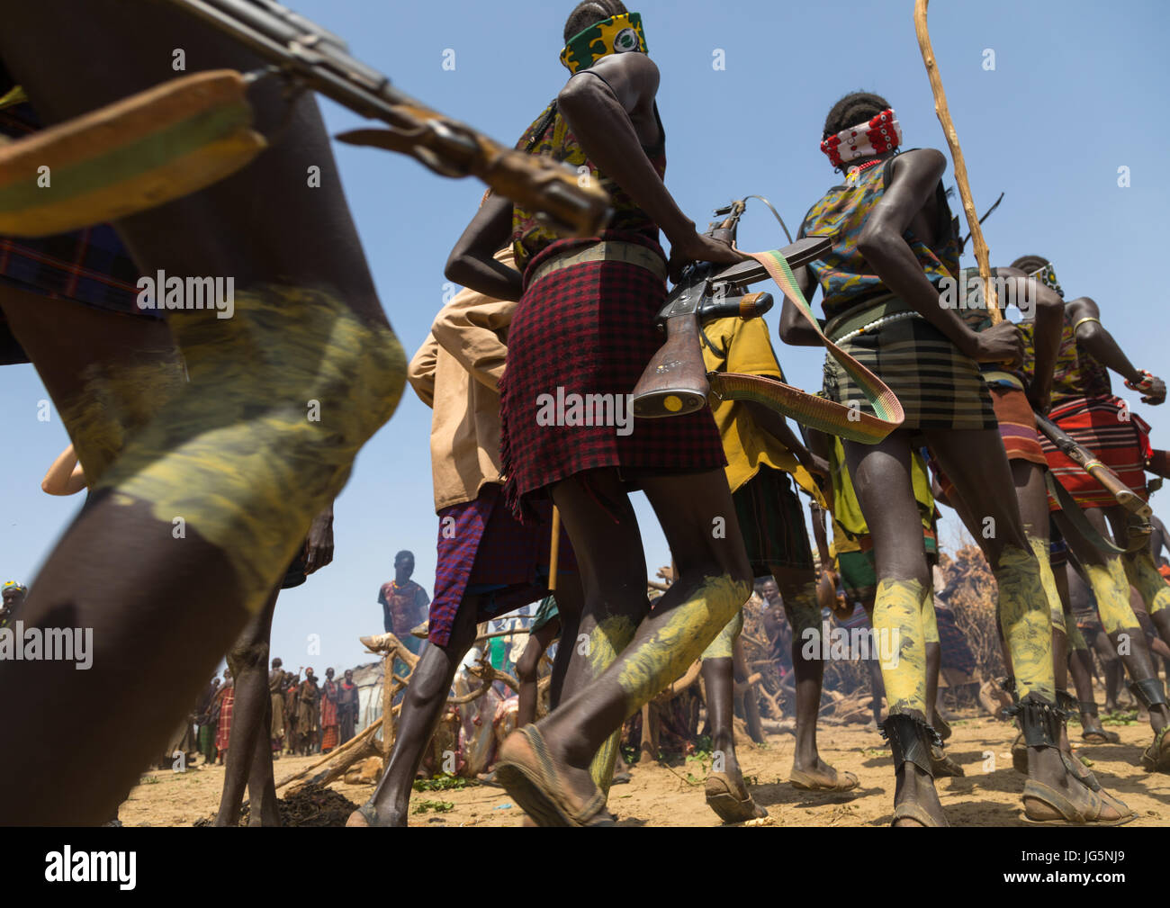 Men with weapons during the proud ox ceremony in the Dassanech tribe ...