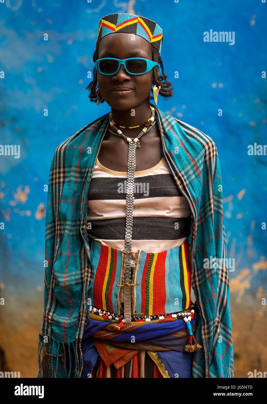 Portrait of a Bana tribe girl in front of a blue wall, Omo valley, Key ...
