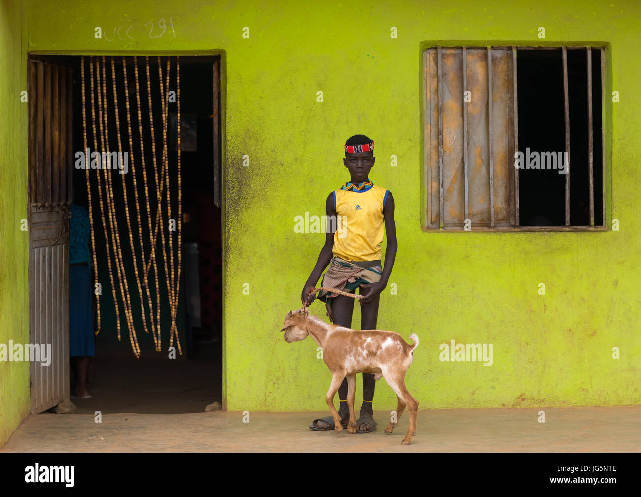Bana tribe boy with his goat in front of a bar, Omo valley, Key Afer ...