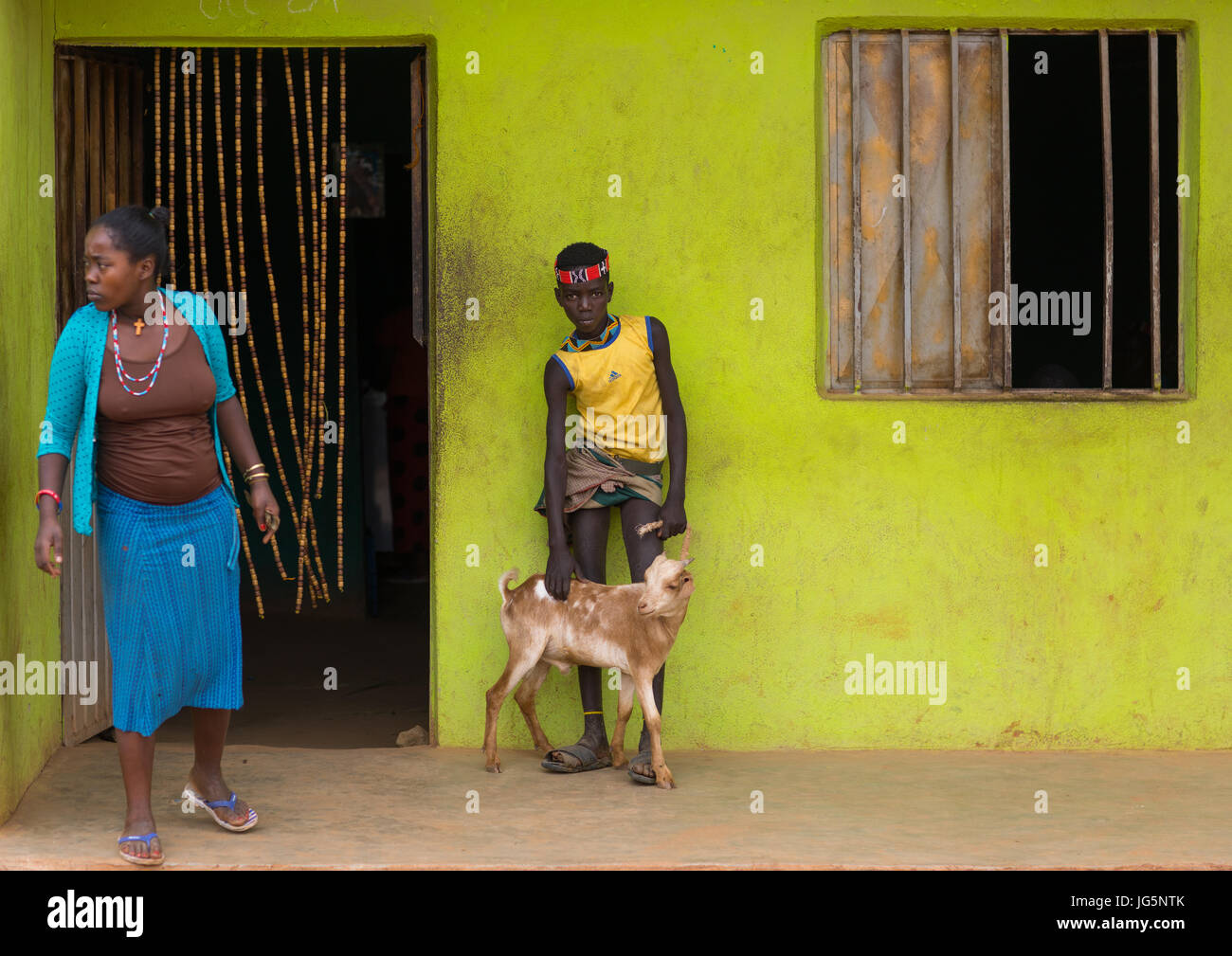 Bana tribe boy with his goat in front of a bar, Omo valley, Key Afer ...