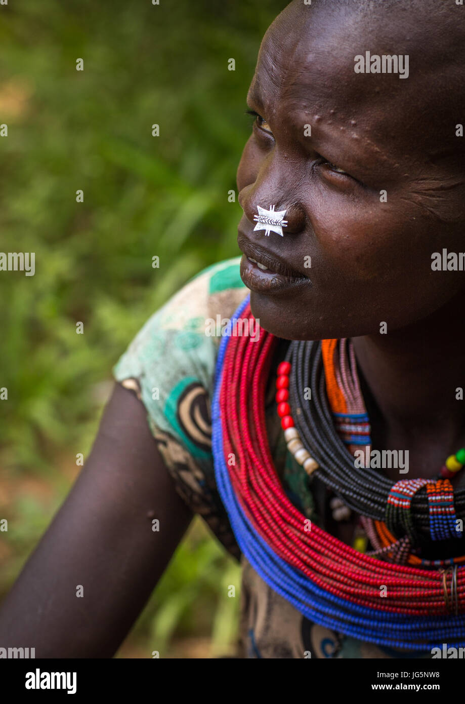 Portrait of a sudanese Toposa tribe woman refugee with huge necklaces ...