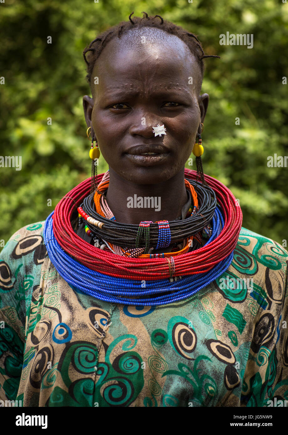 Portrait of a sudanese Toposa tribe woman refugee with huge necklaces ...