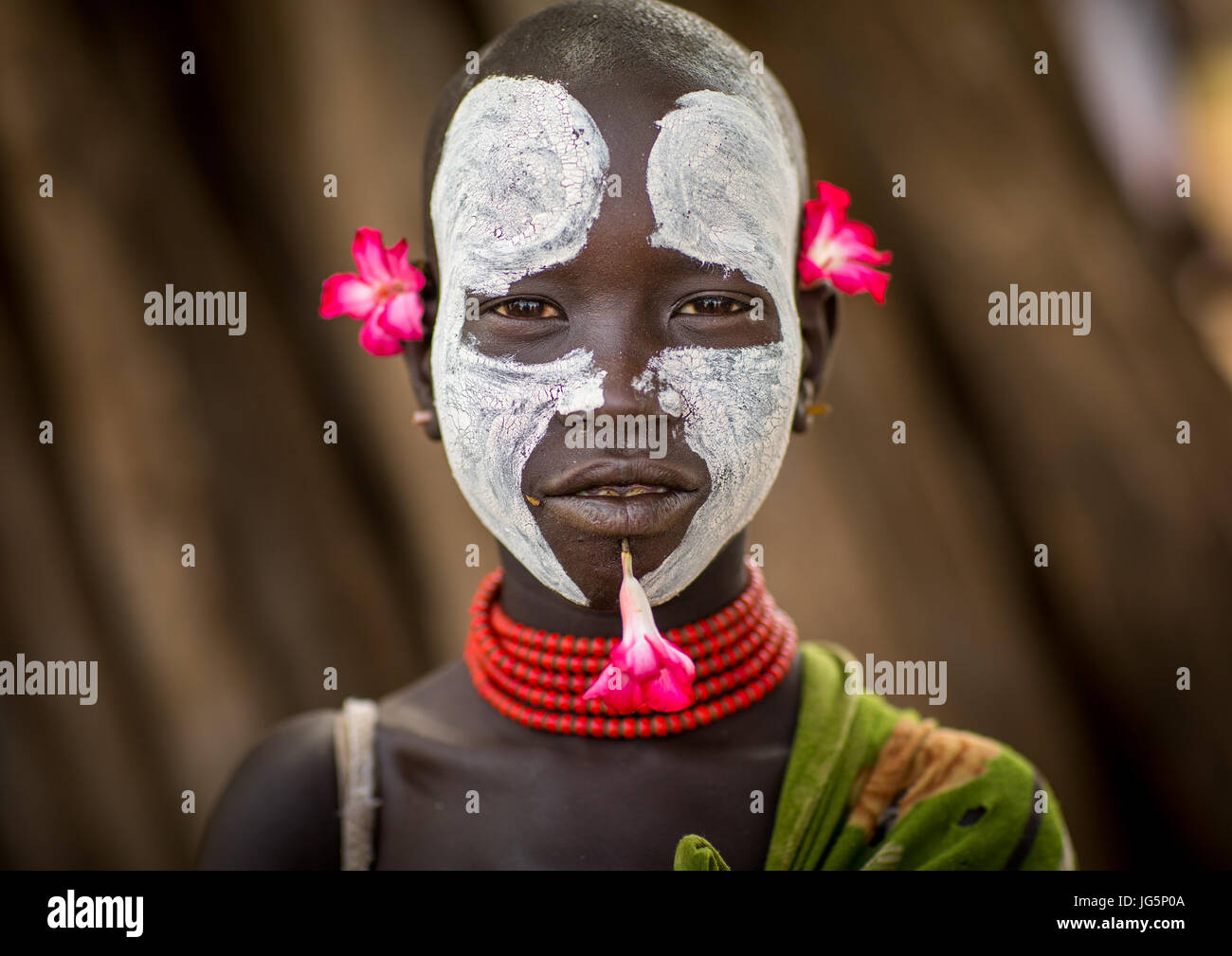 Portrait of a Karo tribe child with flowers decorations, Omo valley ...