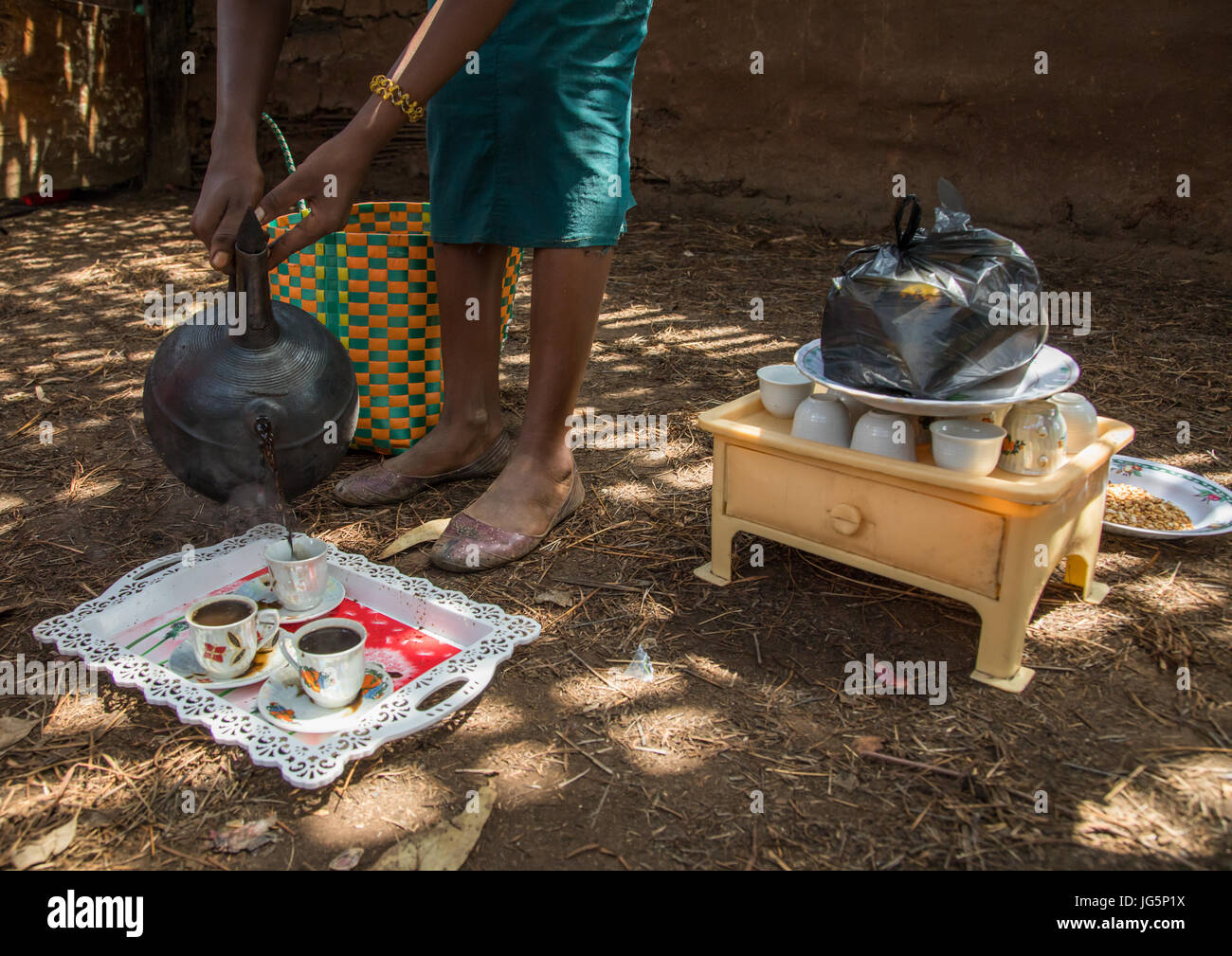Woman serving coffee in a Gurage traditional house, Gurage Zone ...