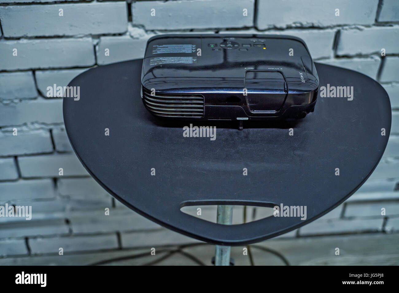 Close up modern projector on table Stock Photo - Alamy
