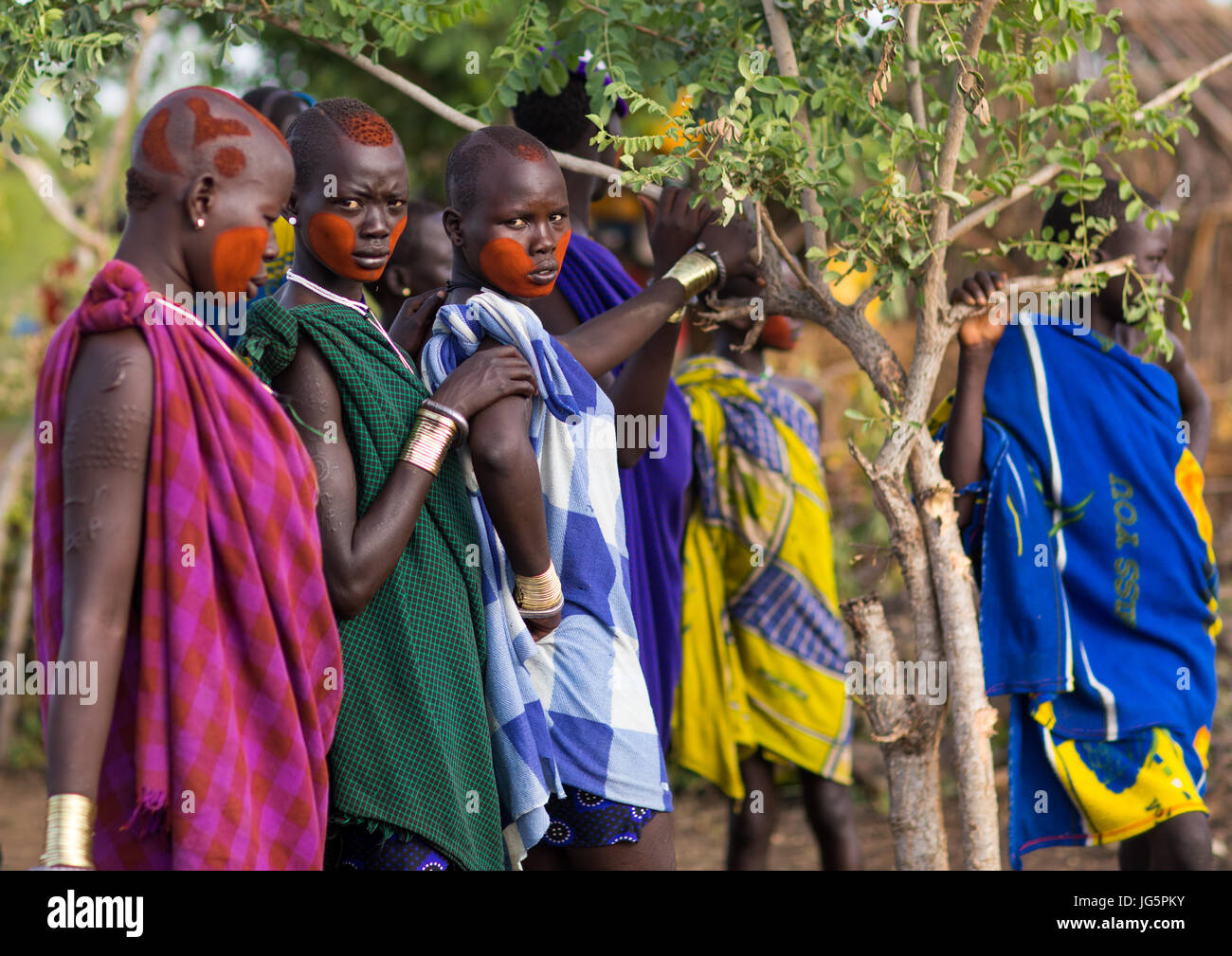 Teenage girls with makeup on the face during the fat men ceremony in ...