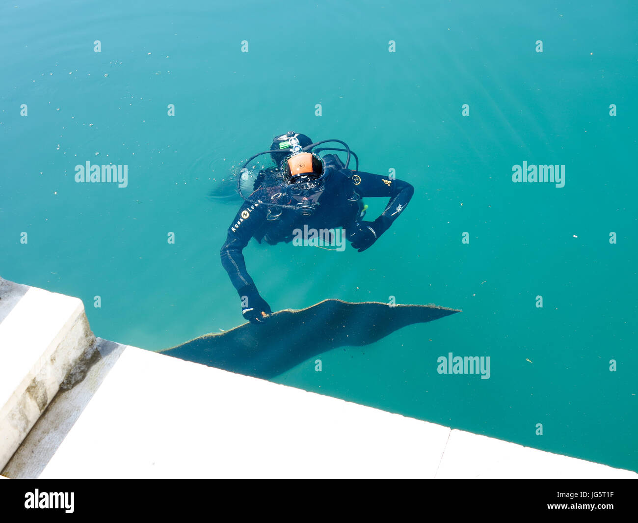 diver surfacing from water Stock Photo - Alamy