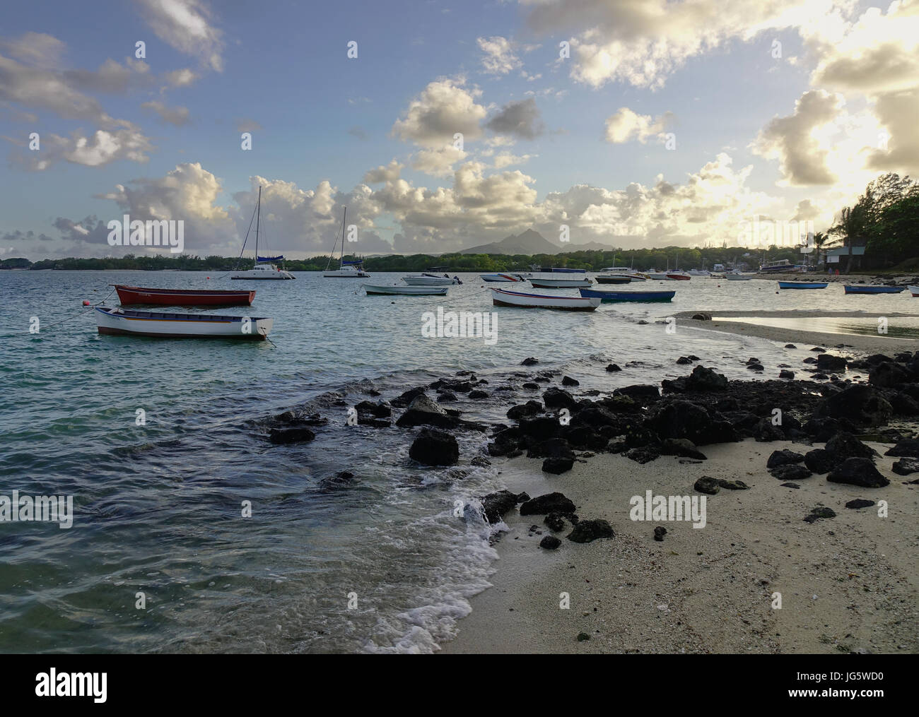 Sunset on the beach in Grand Baie, Mauritius. Mauritius received the ...