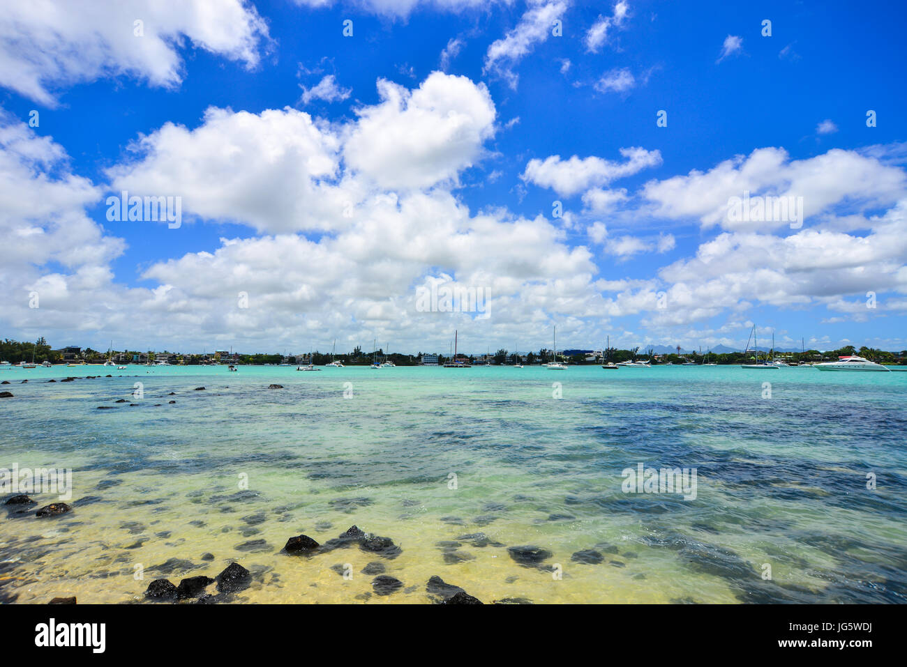 View of the beach at sunny day in Grand Baie, Mauritius. Mauritius is a ...