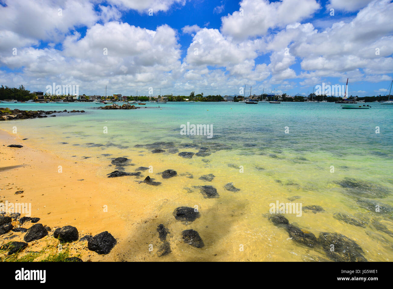 View of the beach in Grand Baie, Mauritius. Mauritius enjoys a tropical ...