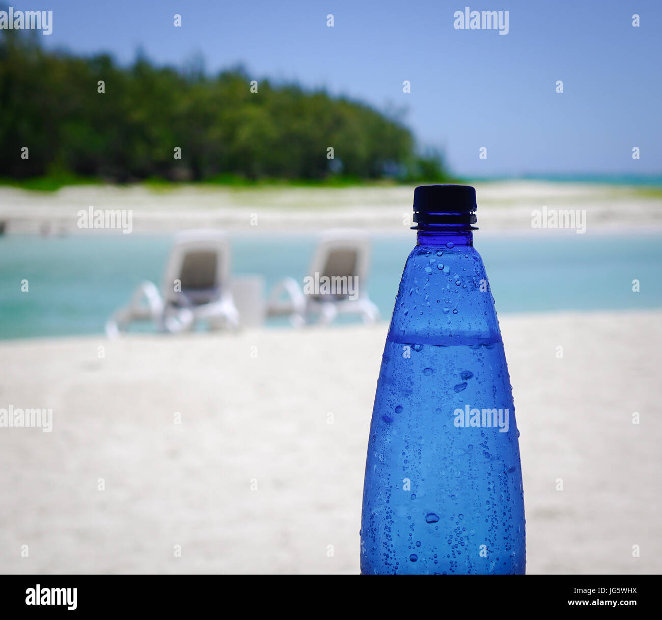 Close-up of plastic bottle of water with the beach background Stock ...