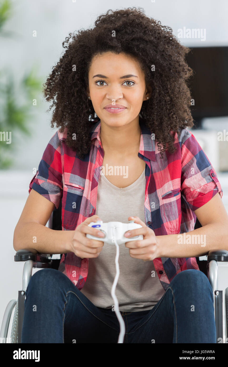disabled female playing video game at home Stock Photo - Alamy