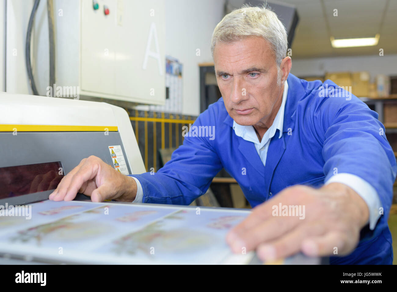 professional man working on printing system Stock Photo - Alamy
