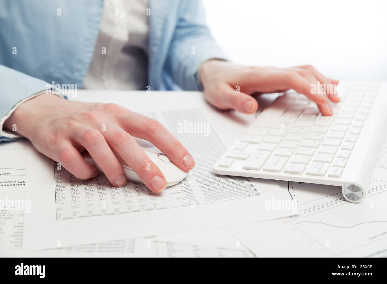 Business woman using computer mouse and keyboard Stock Photo - Alamy