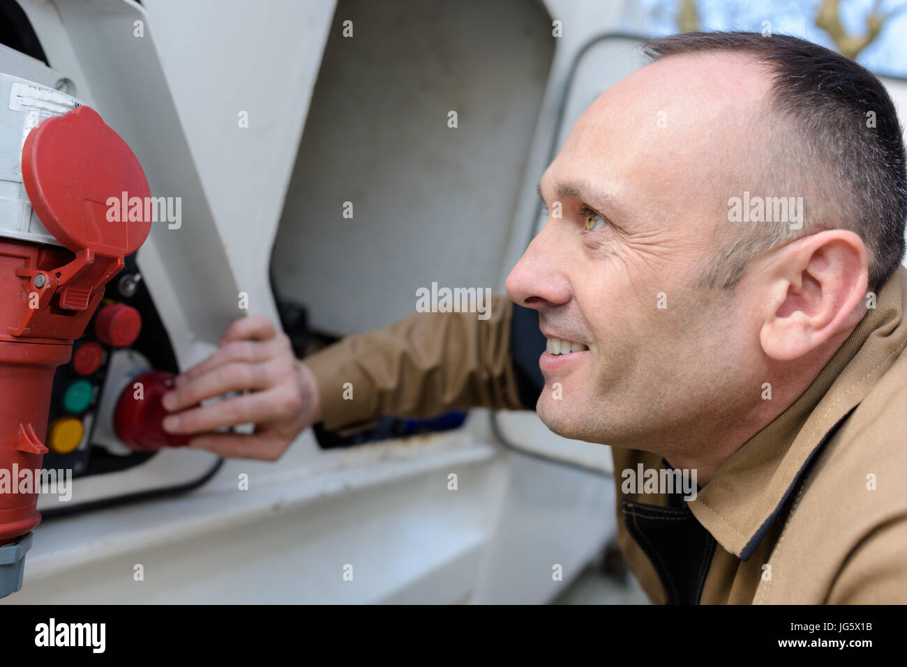 man is pushing fire alarm Stock Photo - Alamy