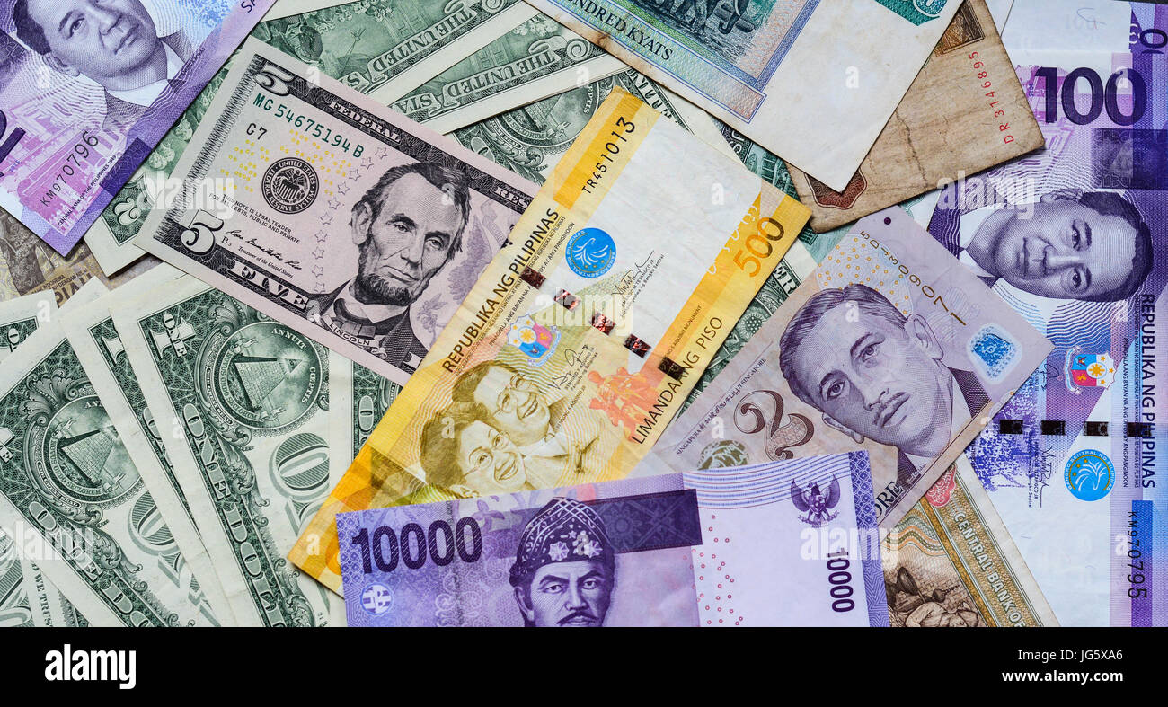 Many banknotes of different countries scattered on the table Stock ...