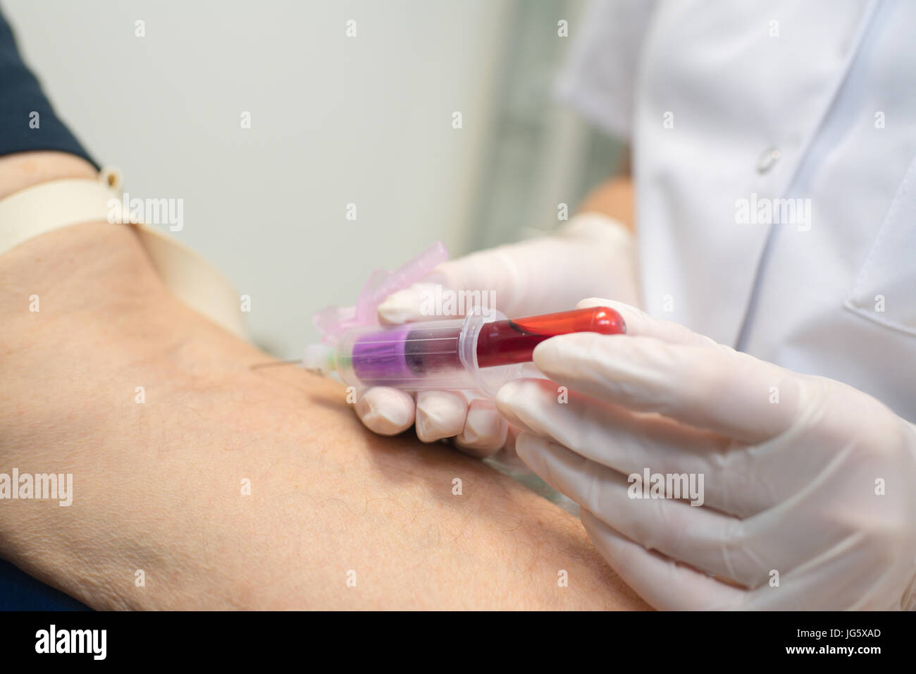 nurse taking a blood sample Stock Photo - Alamy