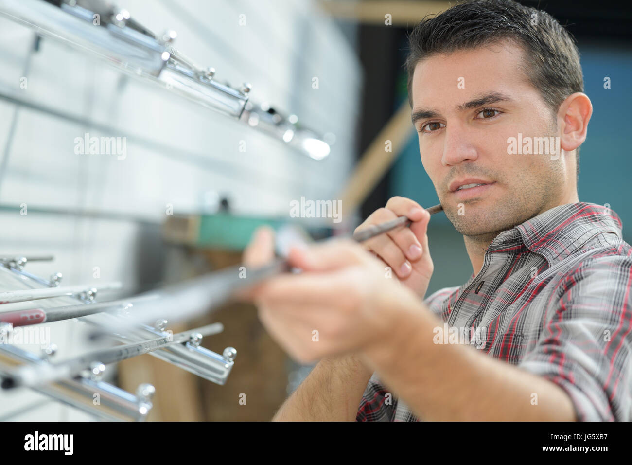 male at display stand Stock Photo - Alamy