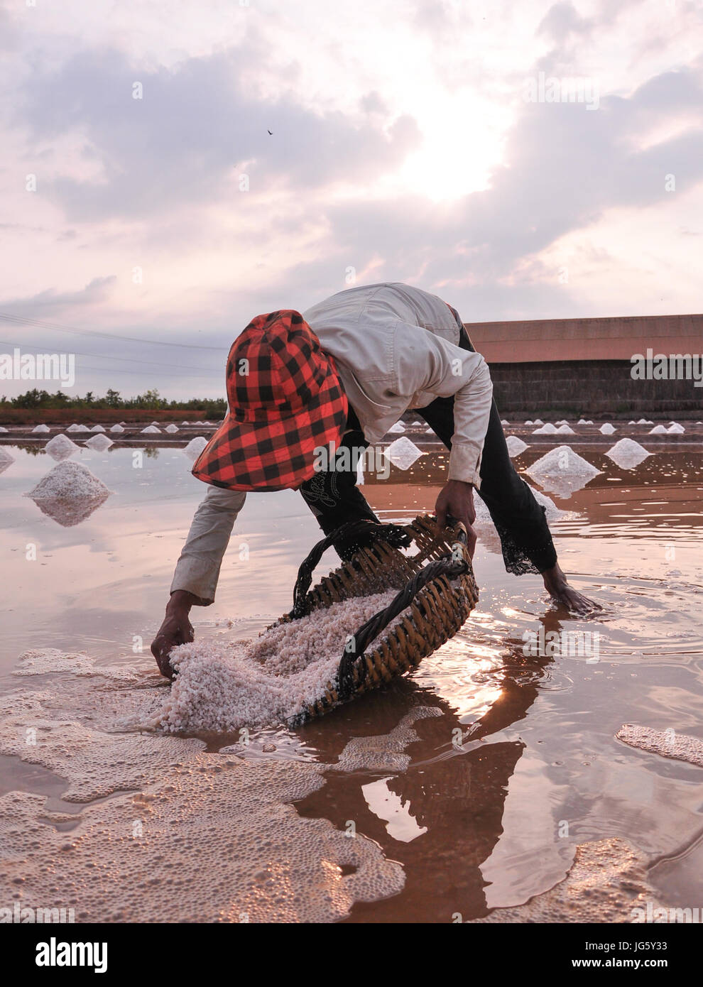 Kampot, Cambodia - Jan 25, 2012. Khmer people working on salt field in ...