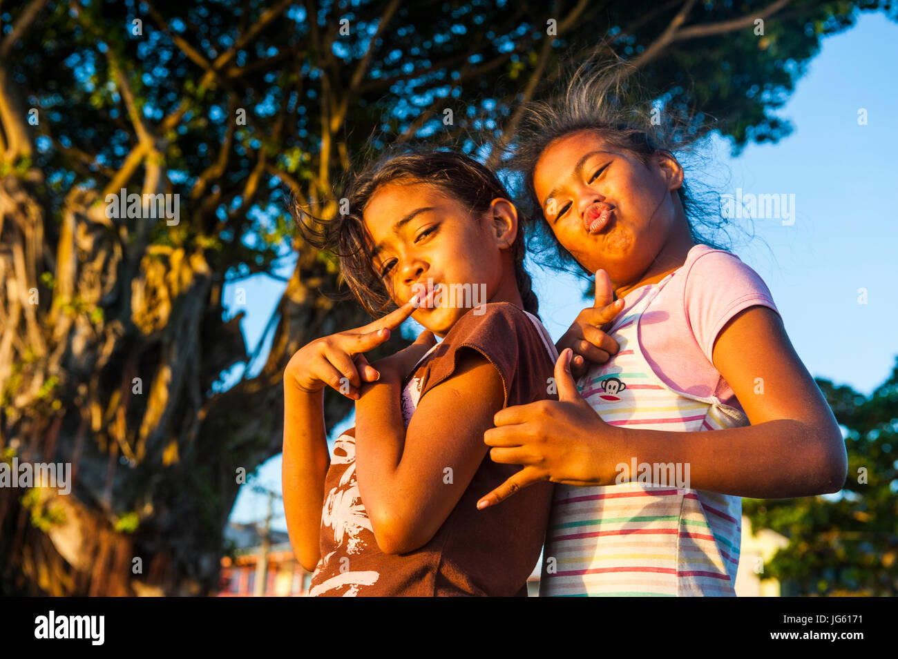 Young girls posing as western actors, Apia, Upolo, Samoa, South Pacific ...