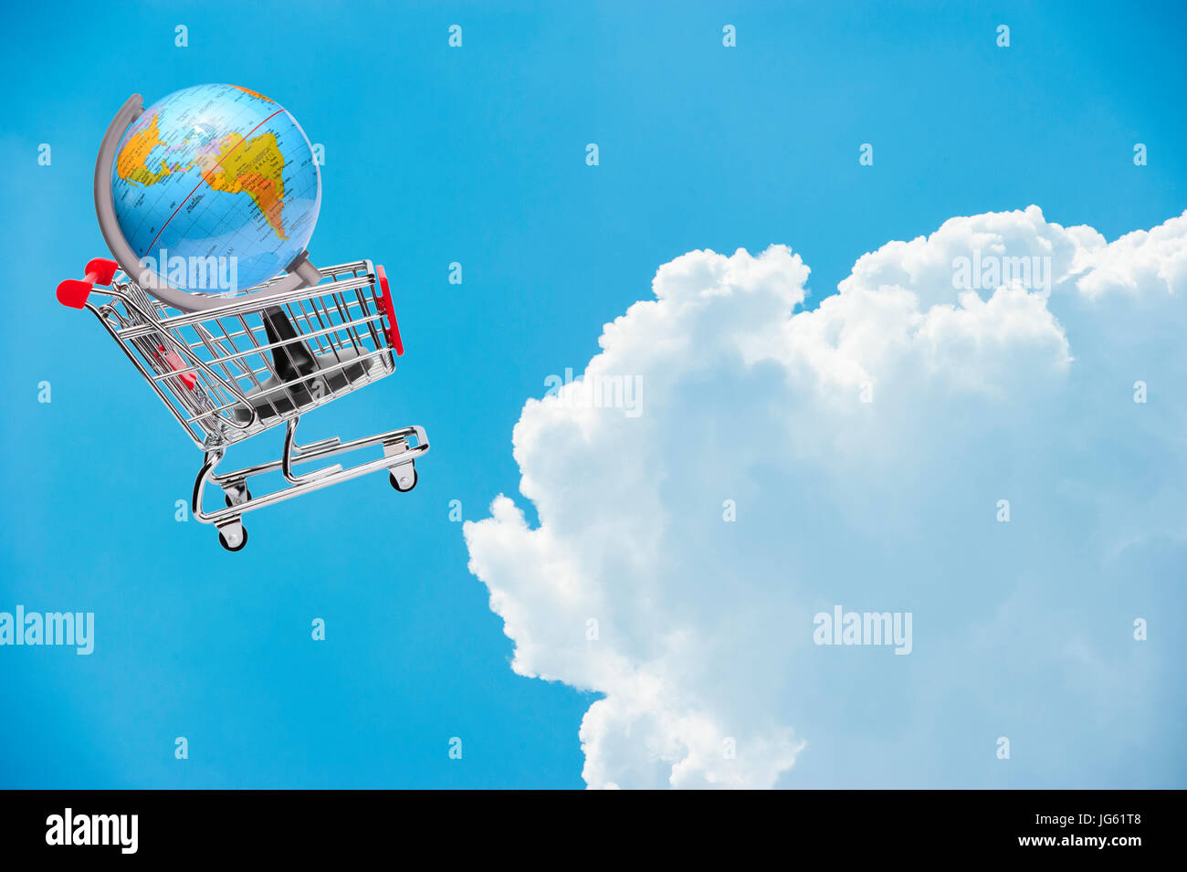 Earth on shopping cart flying at blue sky Stock Photo - Alamy