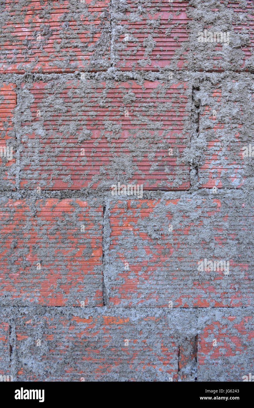 Splatter brick with cement Stock Photo - Alamy