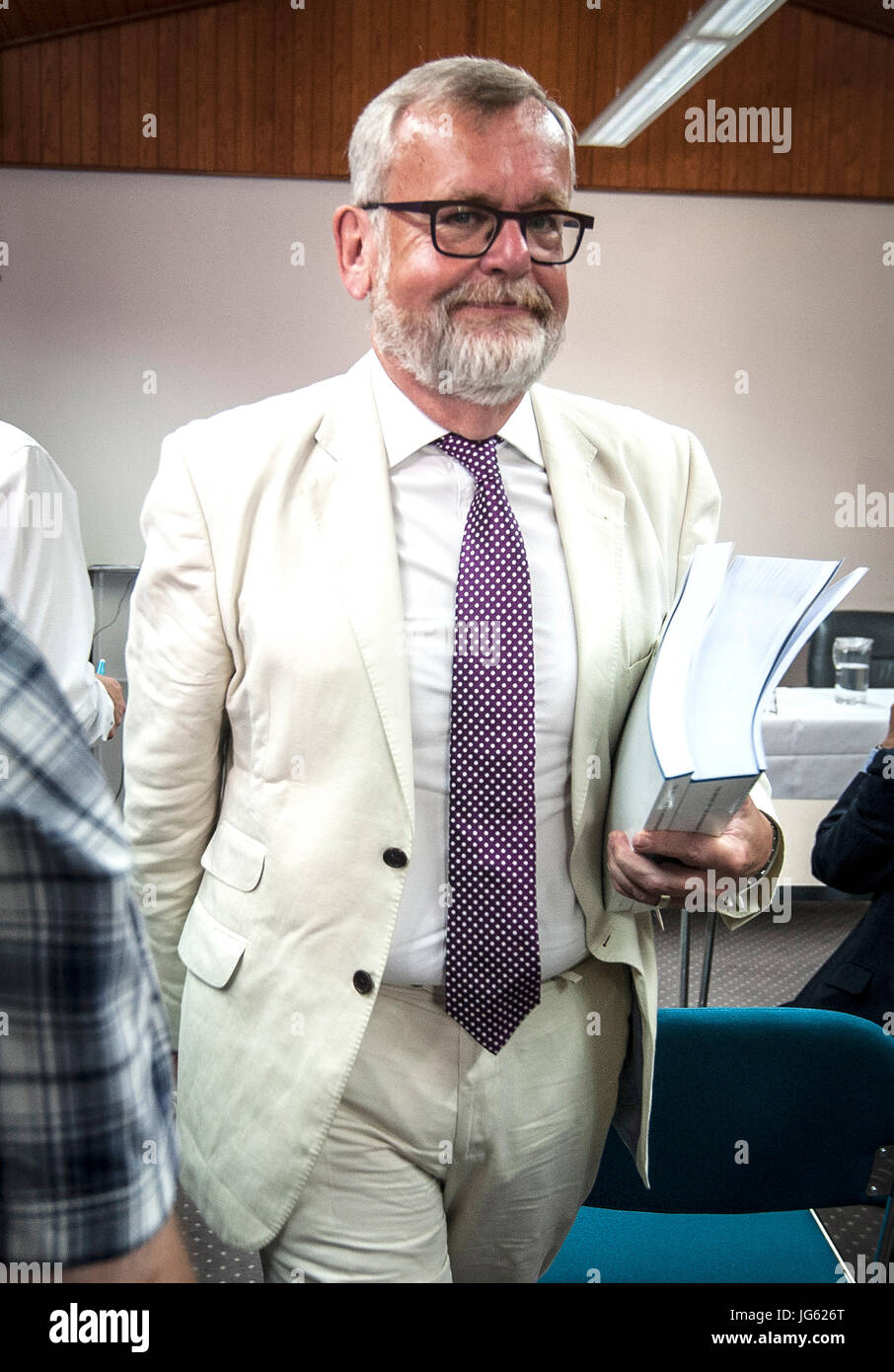 Panel member Professor Sandy Cameron CBE leaves holding a copy of the ...