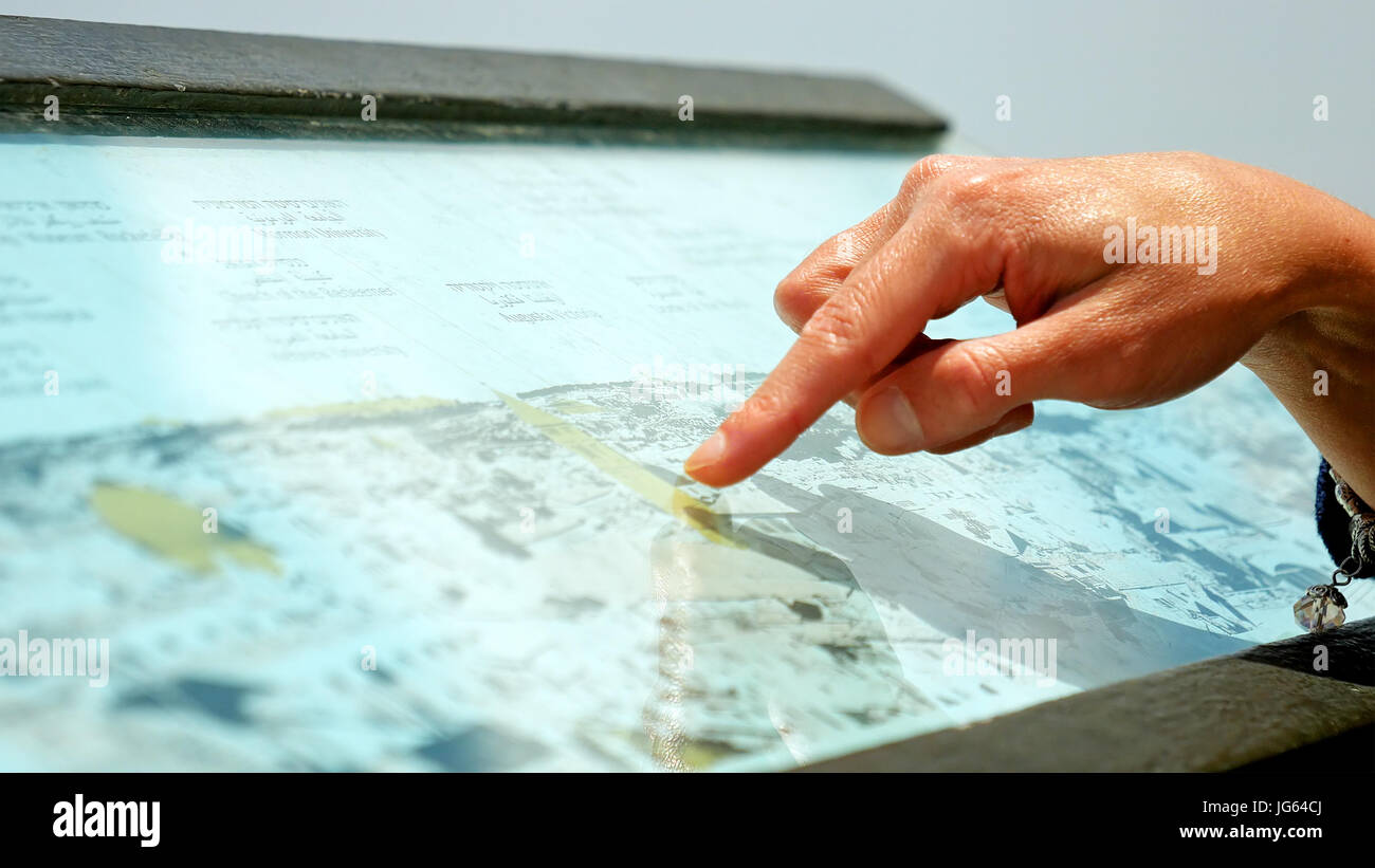 Hands forefingers pointing places on touristic map Stock Photo - Alamy