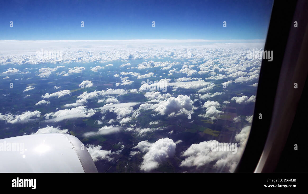 Flying over the clouds. View from plane aircraft Stock Photo - Alamy