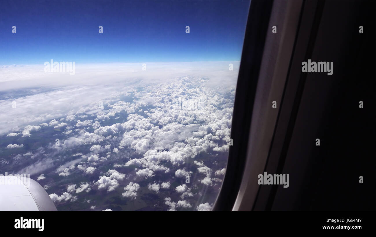Flying over the clouds. View from plane aircraft Stock Photo - Alamy