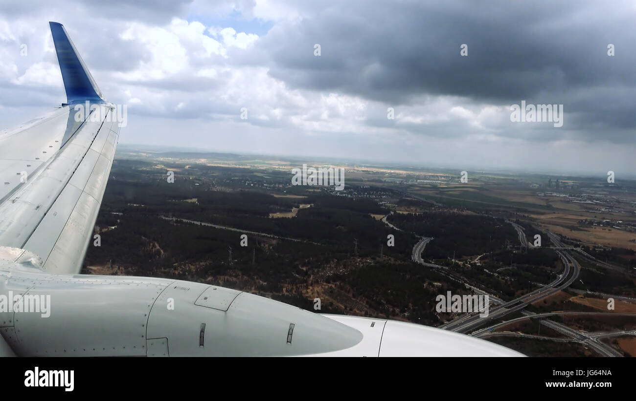 Airliner is landing in a bad weather conditions Stock Photo - Alamy