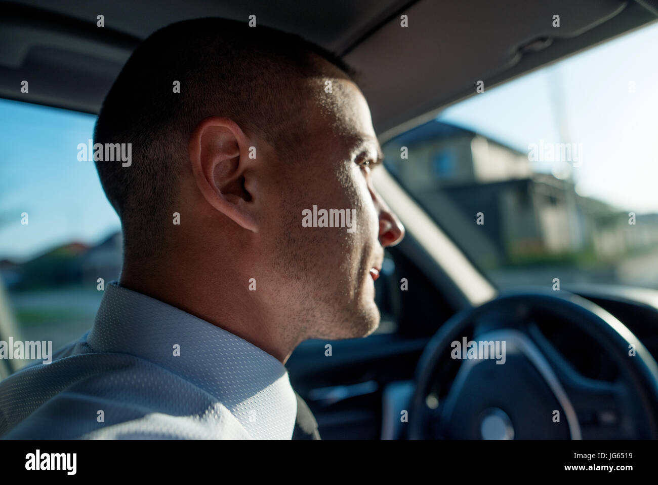 man driving an expensive car Stock Photo - Alamy
