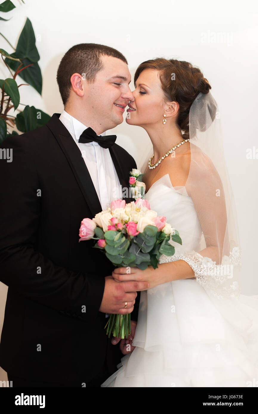 Bride and groom on marriage registration. The groom looks at the bride ...