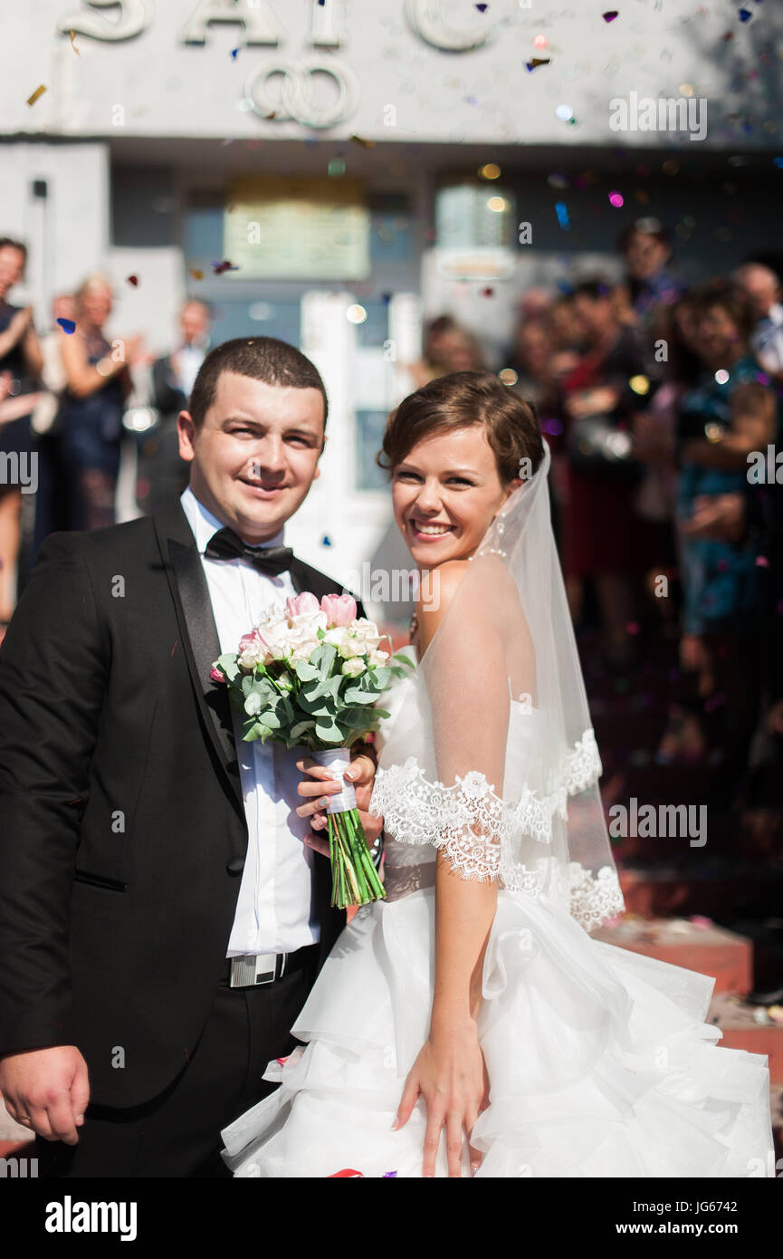 Bride and groom on marriage registration. The groom looks at the bride ...