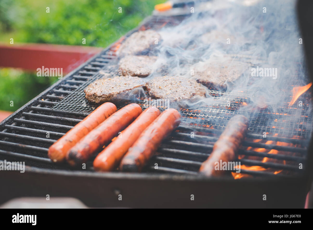 Food cooks on a grill in summer Stock Photo - Alamy