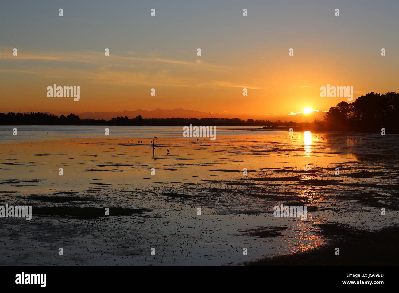 Winter sunset on the estuary Stock Photo - Alamy