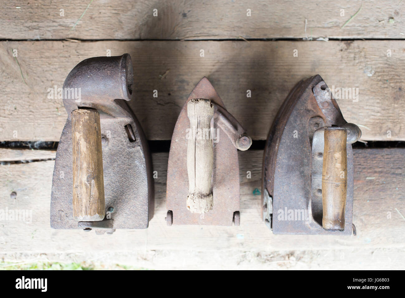 Vintage irons. The iron working on coals. Three models of antique irons ...