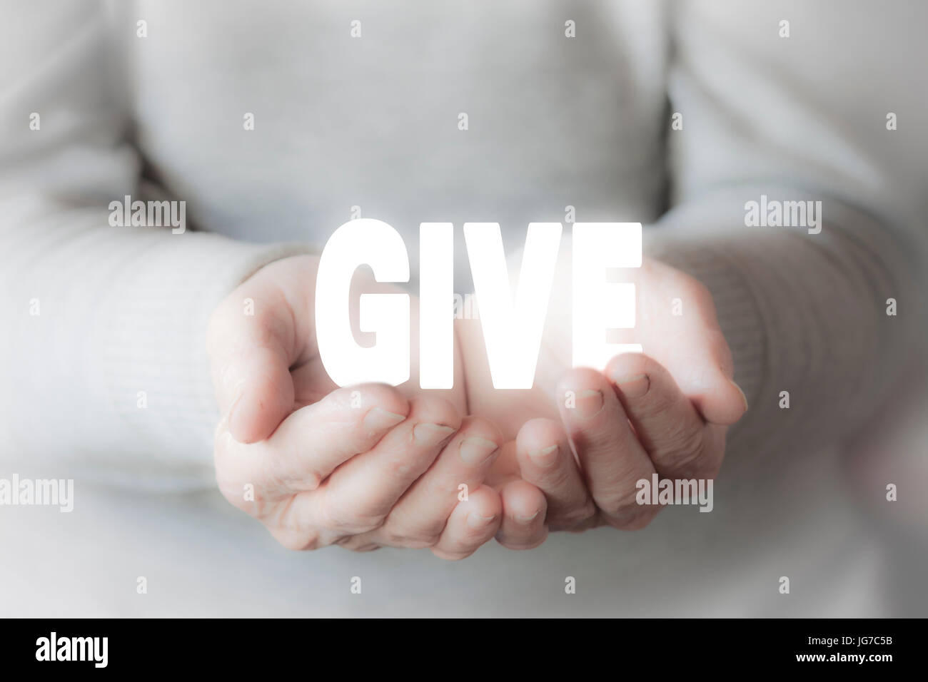 Woman's hands with the write "GIVE Stock Photo - Alamy
