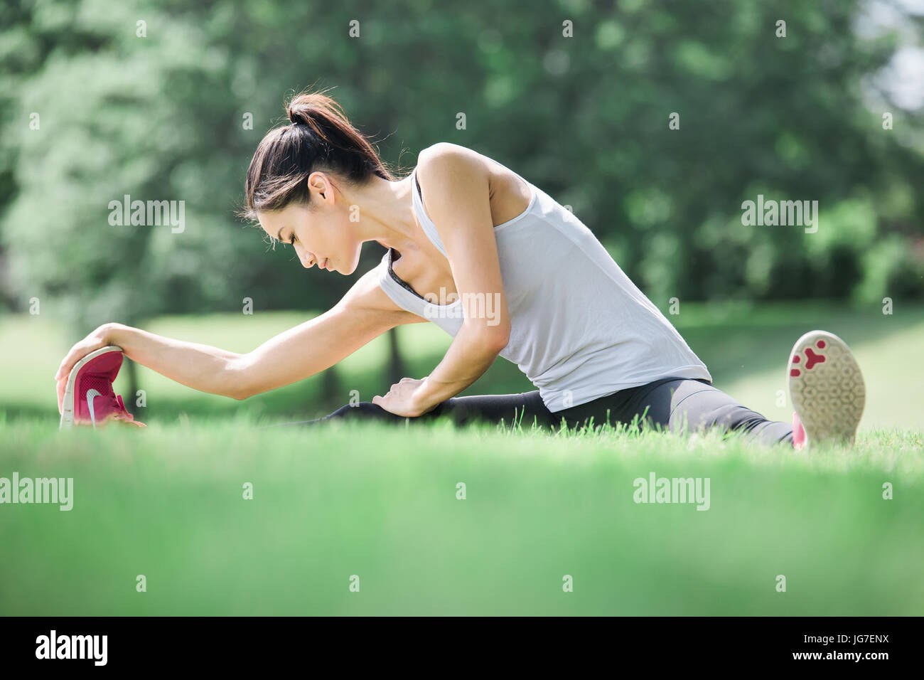 beautiful young woman stretching outdoor Stock Photo - Alamy