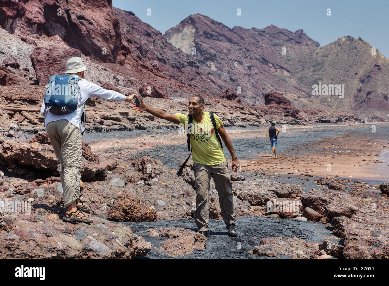 Hormuz Island, Hormozgan Province, Iran - 17 april, 2017: Tourist gives ...