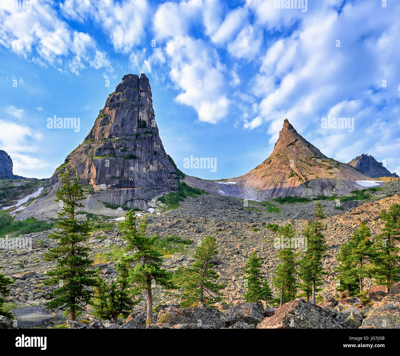 Two mountain peaks form bend in form of mathematical parabola. Rocks ...
