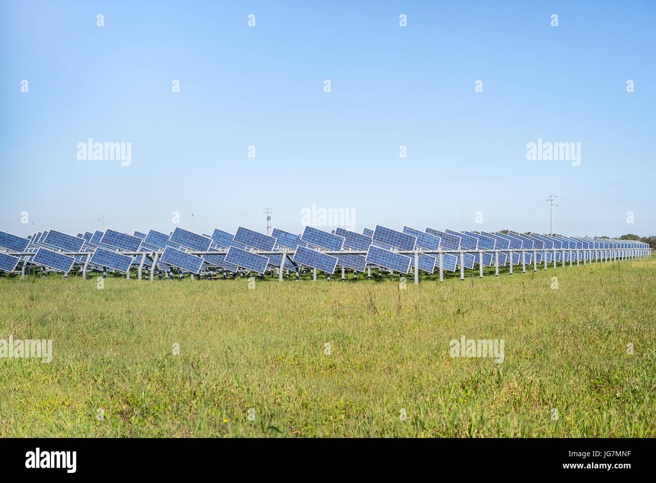 Solar panels on grass against sky hi-res stock photography and images ...