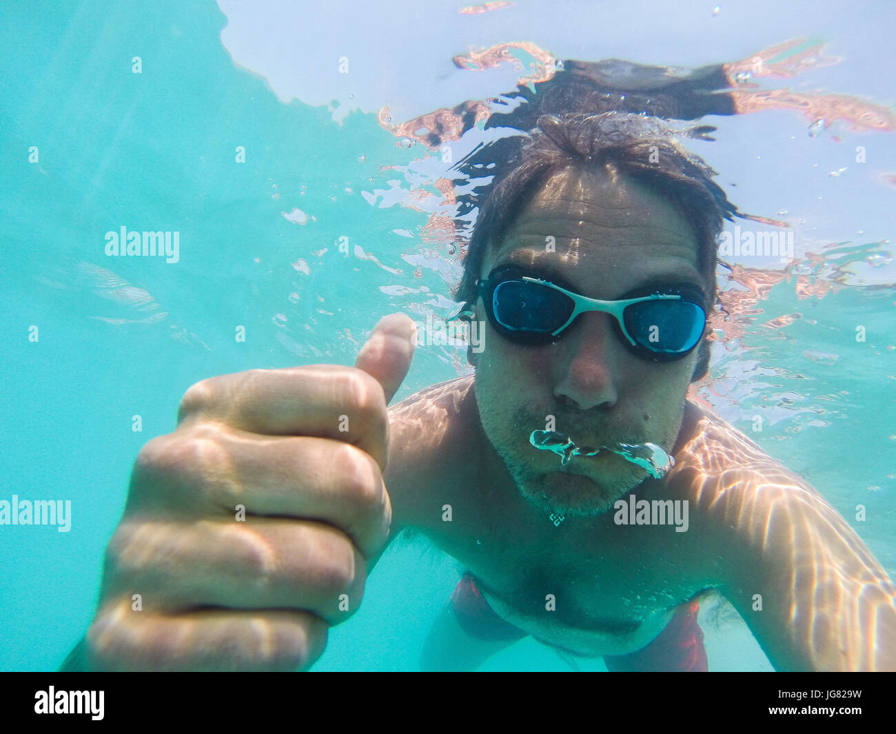 Underwater view people snorkeling in hi-res stock photography and ...