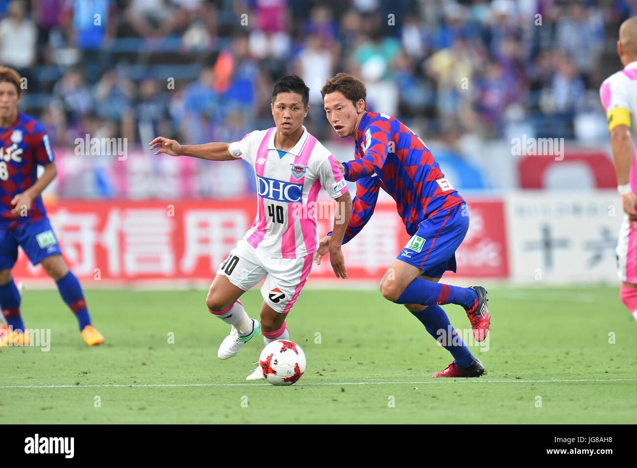 Yamanashi, Japan. 2nd July, 2017. Yuji Ono (Sagan), Ryo Shinzato (Ventforet) Football/Soccer ...