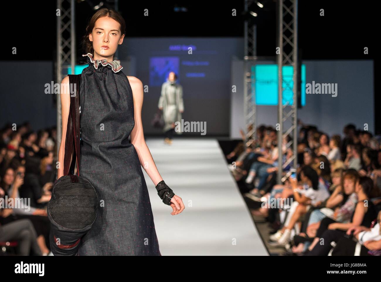 Berlin, Germany. 3rd July, 2017. A model wears clothes designed by ...